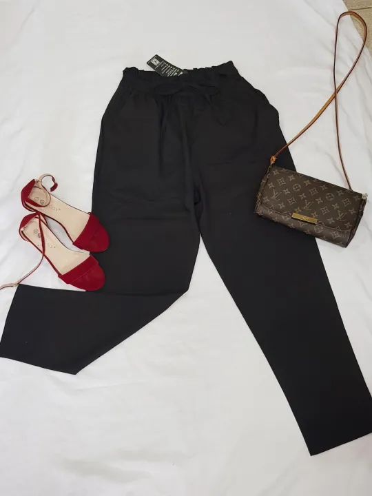 Black garterized high-waisted trousers with two side pocket with tag ...