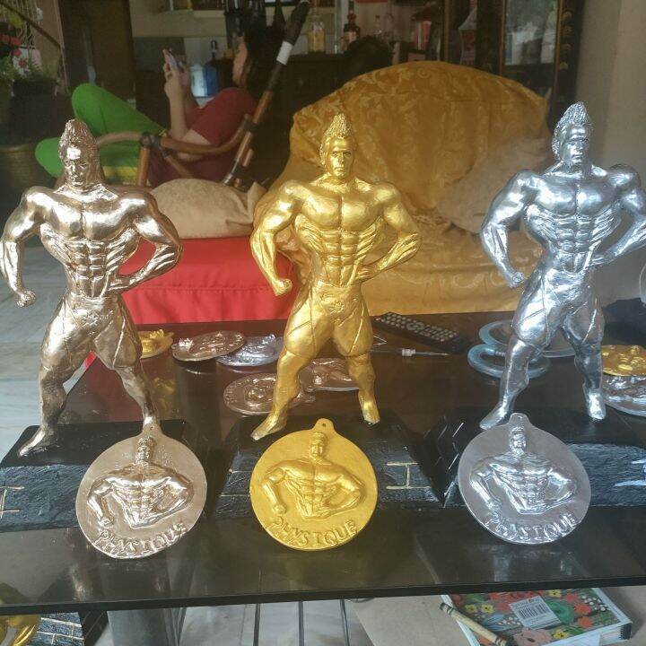 physique trophy .. gold, silver, bronze.. and 3 medal .fiberglass solid ...