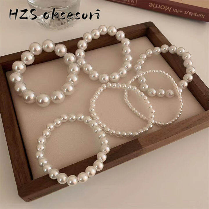 HZS สร้อยข้อมือไข่มุกสตรีเลียนแบบน้ำจืดแก้วสีขาวหรูหรา | Lazada.co.th