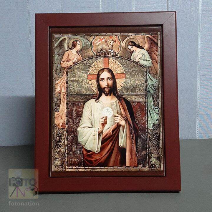 Wooden frame with religious image/Jesus holding the Eucharist printed ...