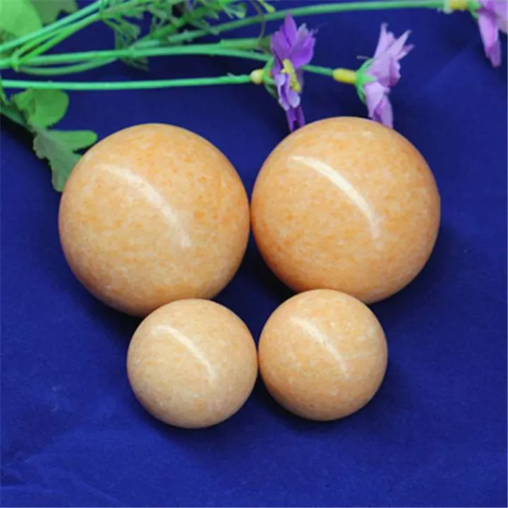 Holding a solid marble ball with jade to exercise fingers, flexible ...