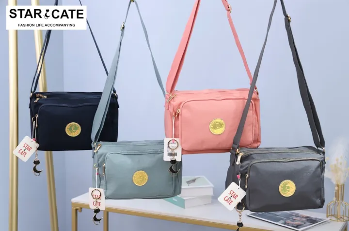 พร้อมส่ง STARCATE-S215 กระเป๋าสะพายข้างผู้หญิง แฟชั่น แบบใหม่ ผ้ากันน้ำ ใบใหญ่ ปรับสายได้ ช่อง ...