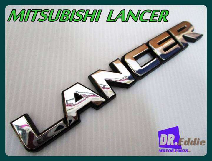 #โลโก้สัญลักษณ์ LANCER สีโครมขอบดำ พร้อมกาวติด(ขนาด 14.5x2 ซม. ...