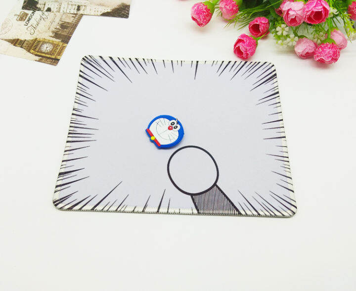 Stretch out the round mouse pad Doraemon robot cat stretched out the ...