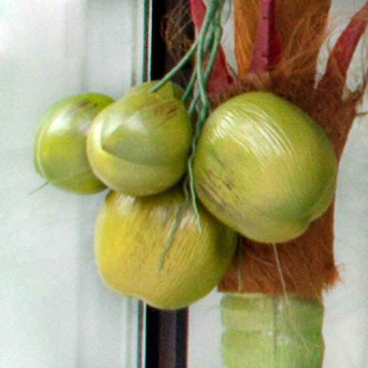 Decorative simulation of coconut palm with real brown hair and fake ...
