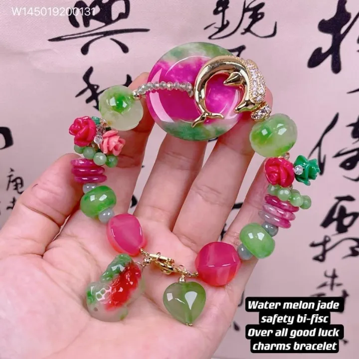 watermelon jade safety bi-disc with lucky dolphin over all good luck ...